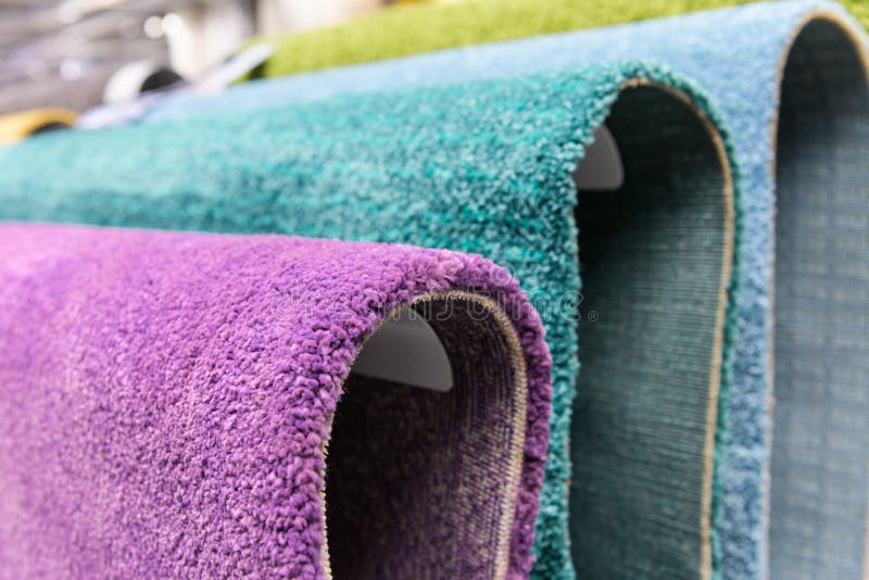 Carpets Hanging on the Shelves in the Carpet Store. Different Carpets ...