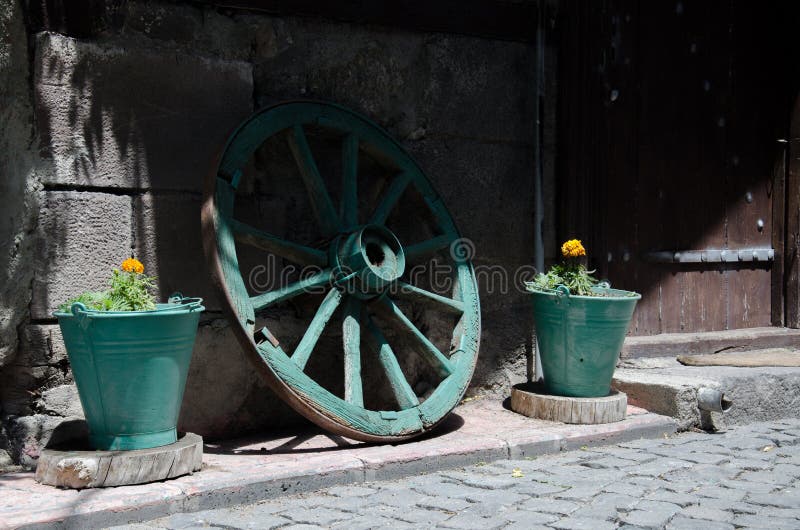 Carriage Wheel and Flower Pots Stock Photo - Image of country, nature ...