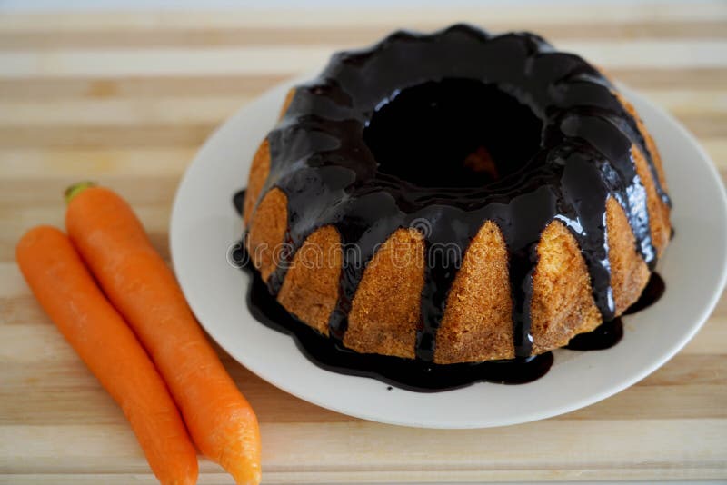 Carrot Cake with Chocolate Icing on Wooden Table. Brazilian Cake Stock ...