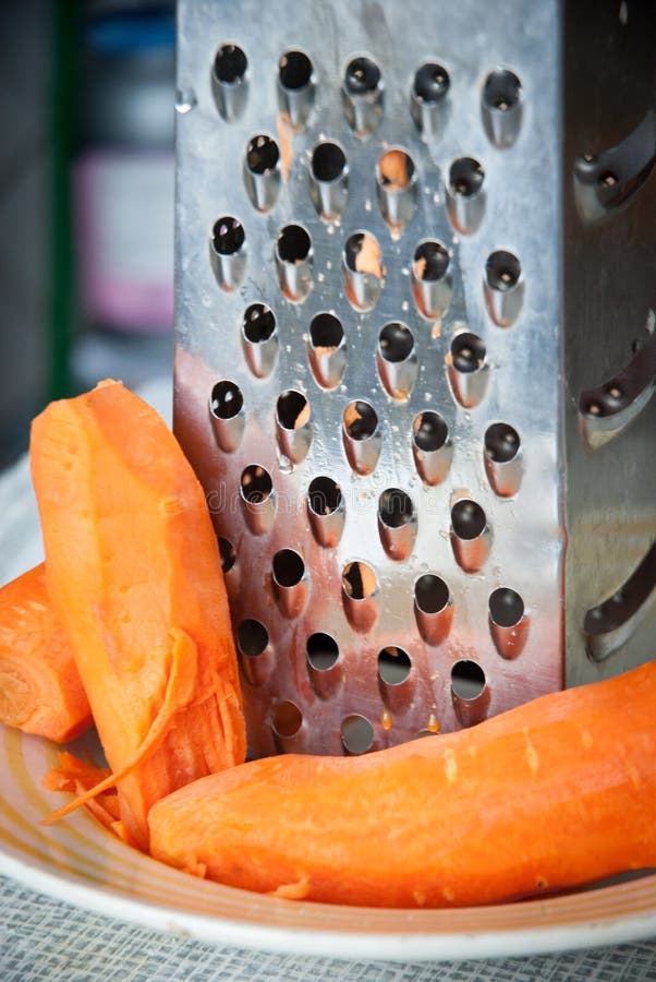 Carrot and Grater for Vegetables Stock Photo - Image of blade ...