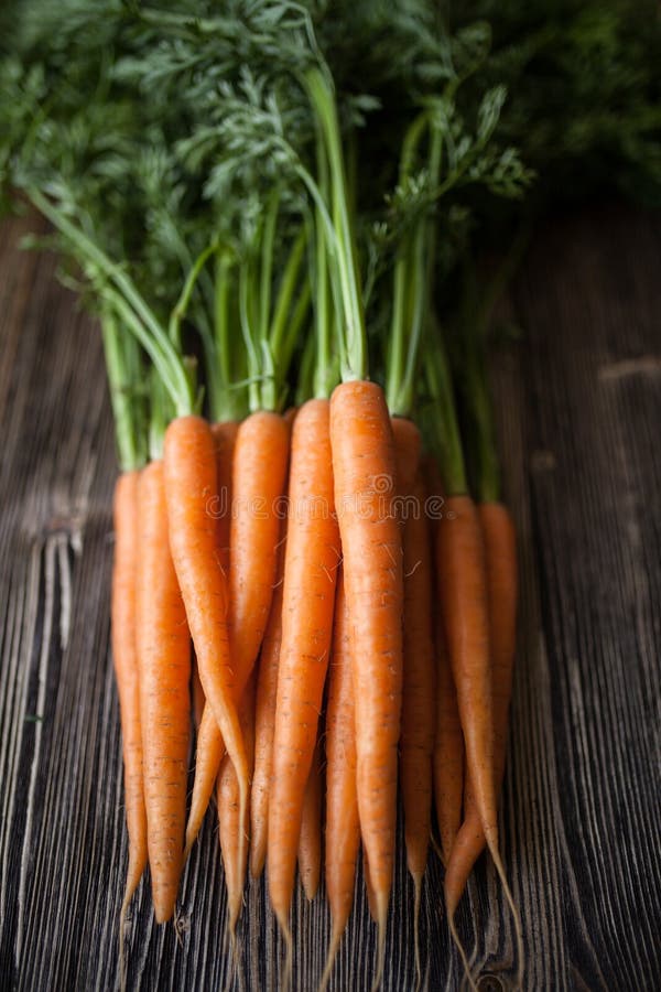 Carrot on wooden table stock image. Image of ripe, food - 100212237