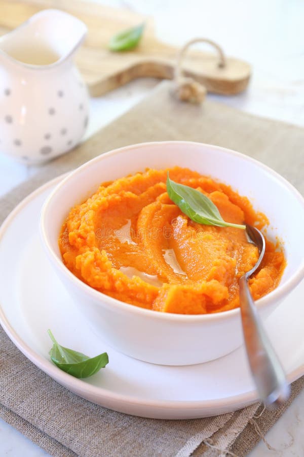 Carrot Puree and Basil in Light Ceramic Dish Stock Photo - Image of ...