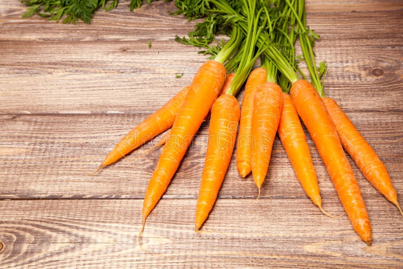 Carrot on a wooden table stock photo. Image of carrot - 37848734