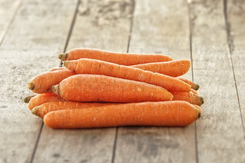 Close Up Of Carrot Bunch On Wooden Table Stock Photo - Image of ...