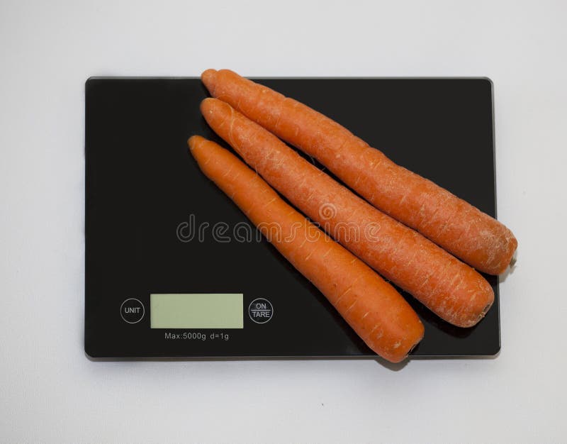 Carrots on Scale stock image. Image of fitness, heavy - 4437487
