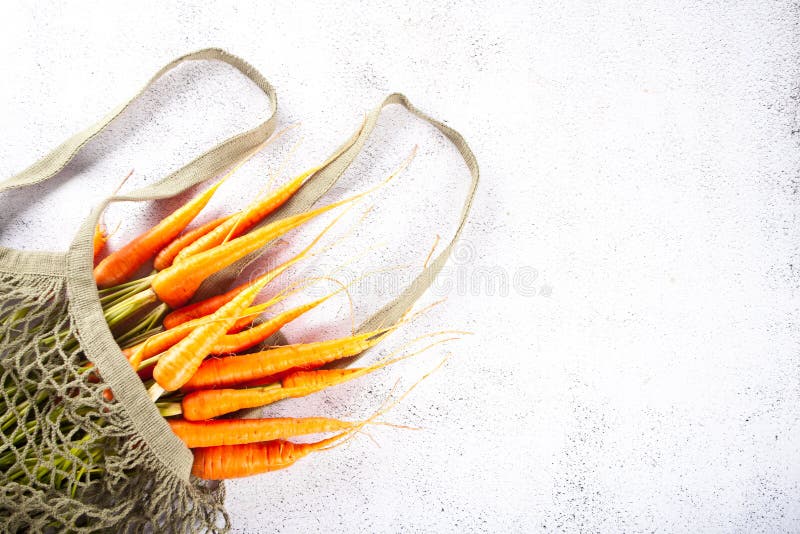 Carrots in an Eco-friendly Net Bag. Top View. Copy Space. Stock Photo ...