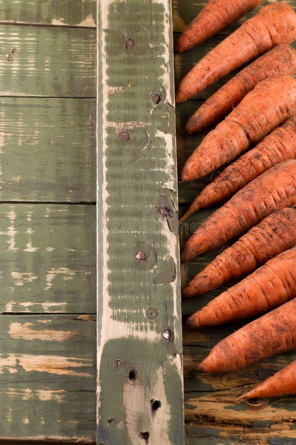 Carrots on an old table stock image. Image of organic - 60450475