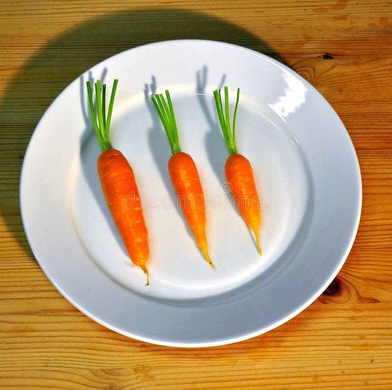 Three Carrots On White Plate Stock Photo - Image of light, dining: 14919708