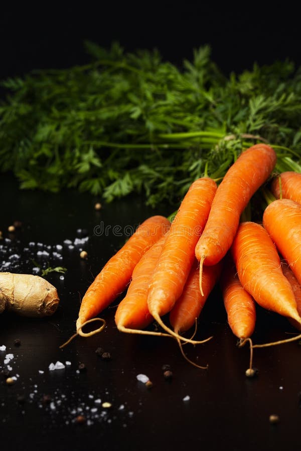 Carrots on wooden table stock photo. Image of natural - 56957298