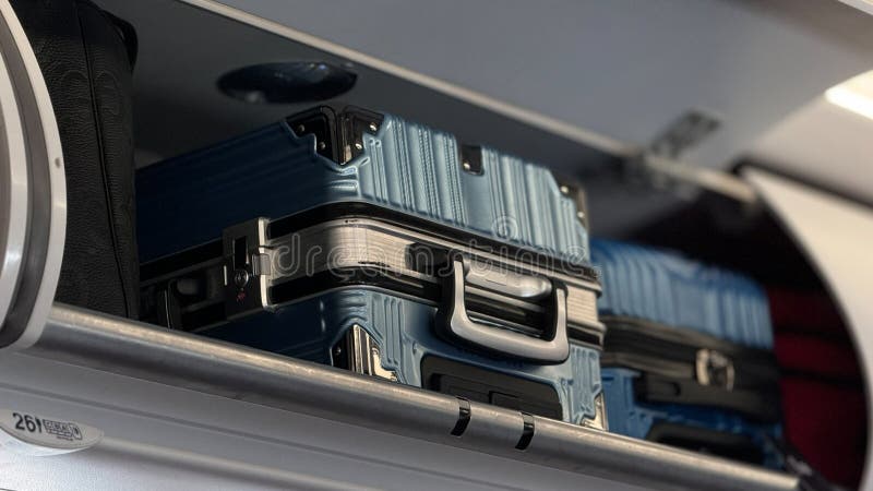 Carry-on Baggage. the Suitcases Inside the Plane are Neatly Placed on ...