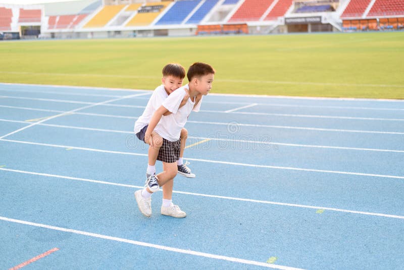 Carry boy stock image. Image of field, asian, sports - 68532675
