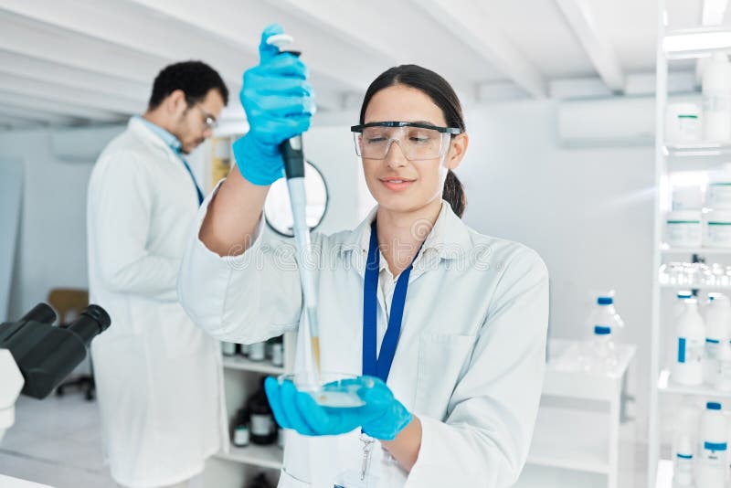 Carrying Out Routine Lab Tasks. a Young Scientist Working with Samples ...