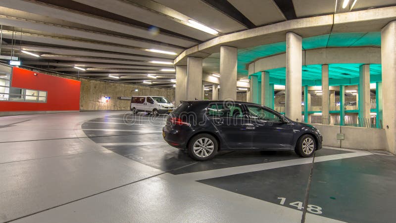 Cars in Circular Underground Parking Garage Stock Image - Image of ...