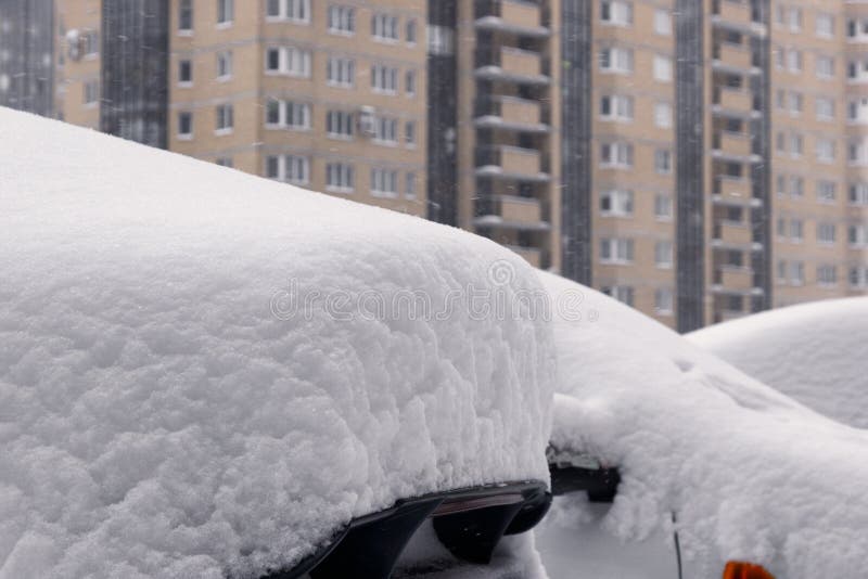 Cars Covered in Snow in the City among High-rise Structures Stock Image ...