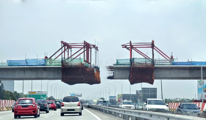 Cars Drive on a Busy Highway with a Bridge Under Construction Stock ...
