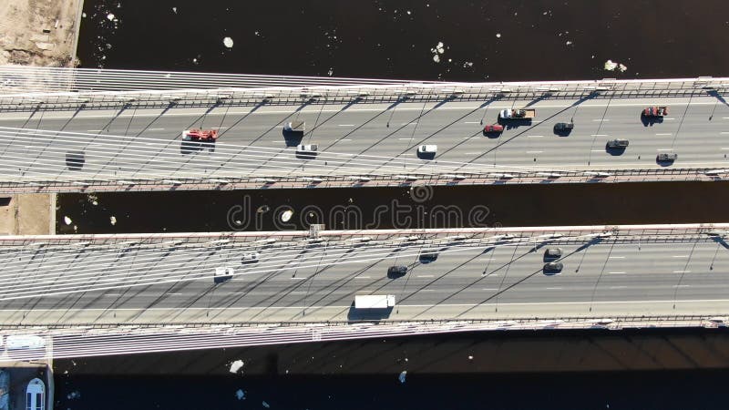 Cars Drive on Cable-stayed Bridge Over the River, Aerial View, Camera ...