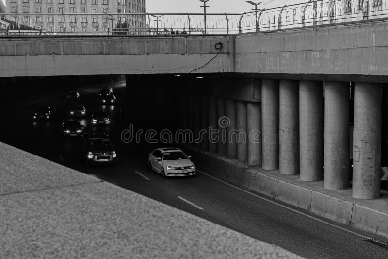 Cars Drive Under the Bridge Editorial Photo - Image of crowded, black ...