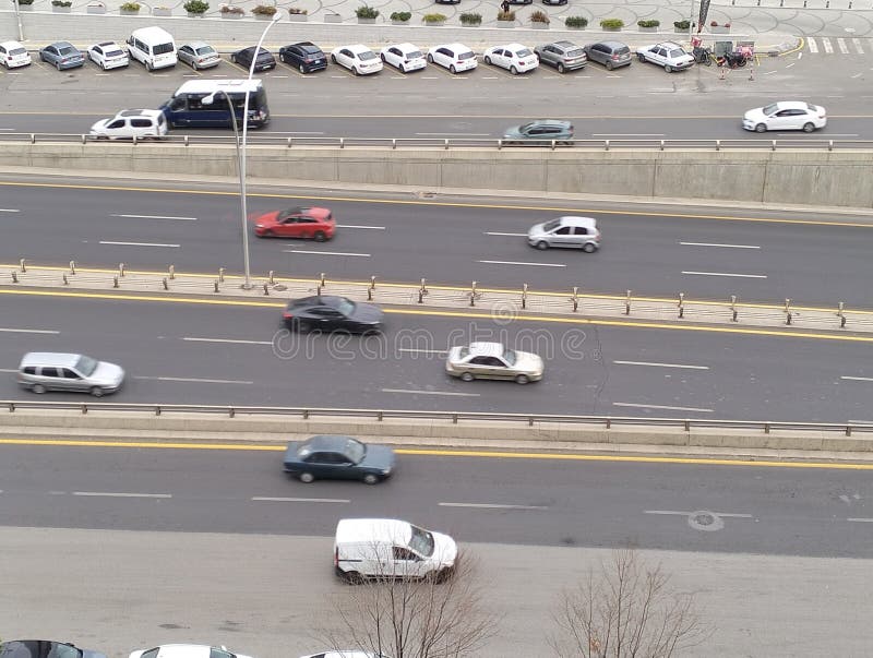 Two Cars are Moving Along a Solid Road Marking Line. One of the Cars is ...