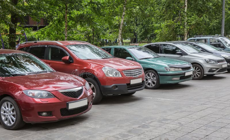 Cars parked in a row. stock image. Image of street, line - 105357801