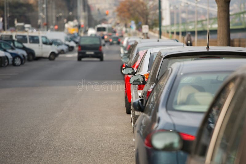 Cars Parked in a row stock image. Image of urban, commuter - 71054627