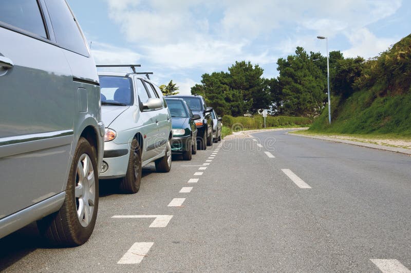 Cars Parked on the Side of the Empty Road Stock Photo - Image of light ...