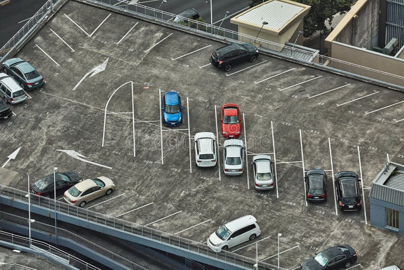 Cars parking on a rooftop stock image. Image of crowded - 258667615