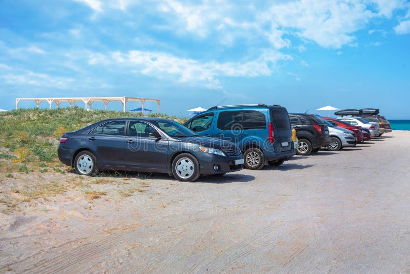 Cars on a sandy beach stock photo. Image of cars, color - 154936408