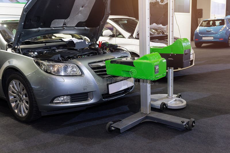 Cars at Service Stations and Car Equipment for Adjusting the Headlights ...