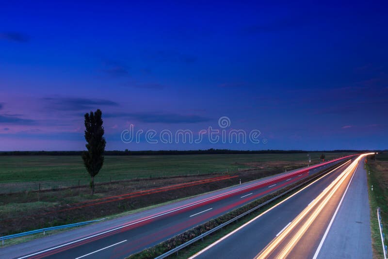 Cars speeding on a highway stock photo. Image of journey - 39080190