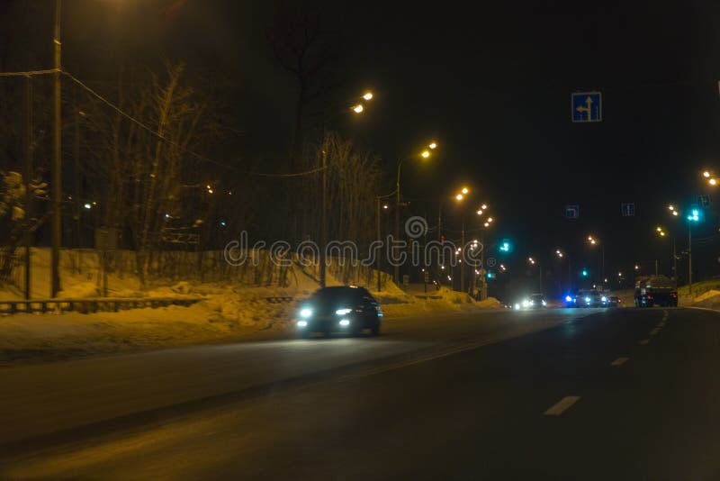 Cars in Traffic in Winter in the Evening Dark Stock Photo - Image of ...