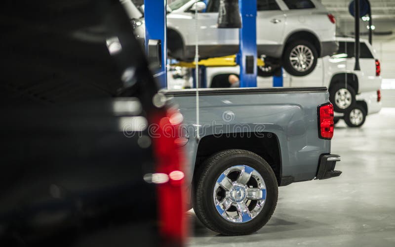 Cars Under Maintenance Inside an Auto Service Stock Photo - Image of ...