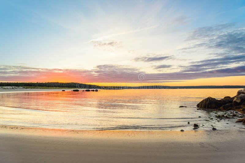 Carters Beach at sunset stock image. Image of coast, rock - 61612603