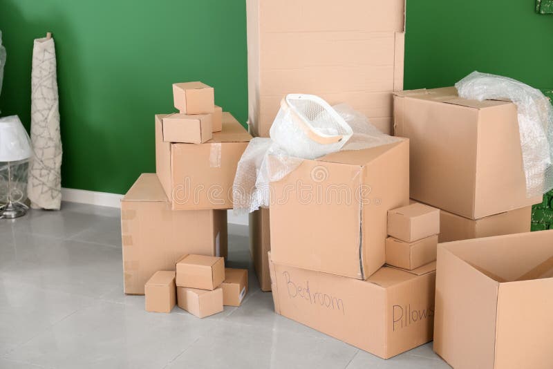 Carton Boxes and Interior Items in Room. Moving House Concept Stock ...
