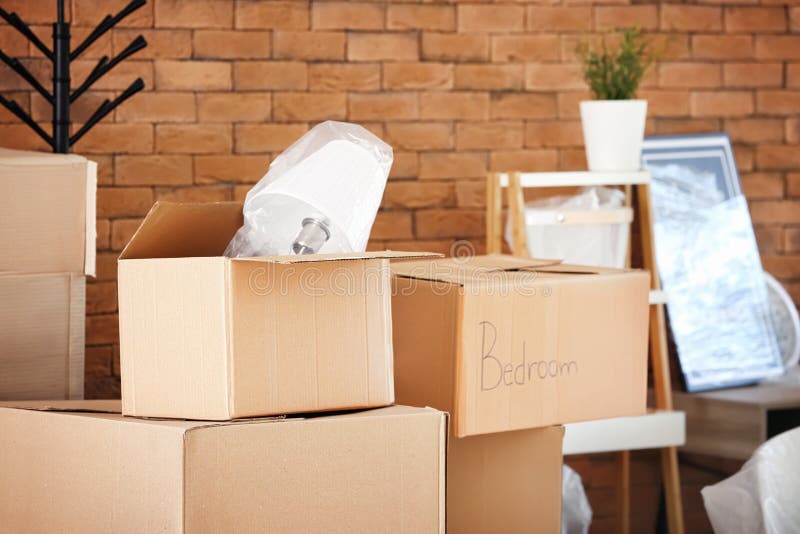 Carton Boxes and Interior Items in Room. Moving House Concept Stock ...