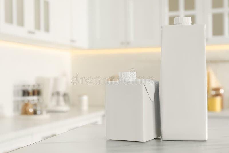 Carton Boxes of Milk on Table in Kitchen Stock Photo - Image of ...