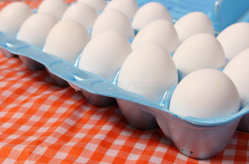 Carton of Eggs on Rustic Table with Checkered Table Cloth Stock Photo ...