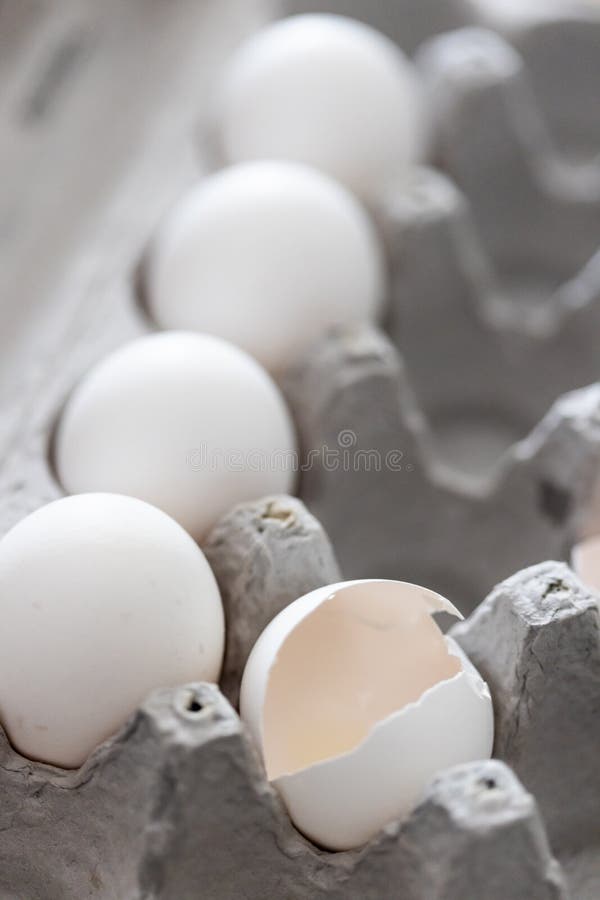 Broken Egg Shells in a Carton of White Chicken Eggs Stock Photo - Image ...