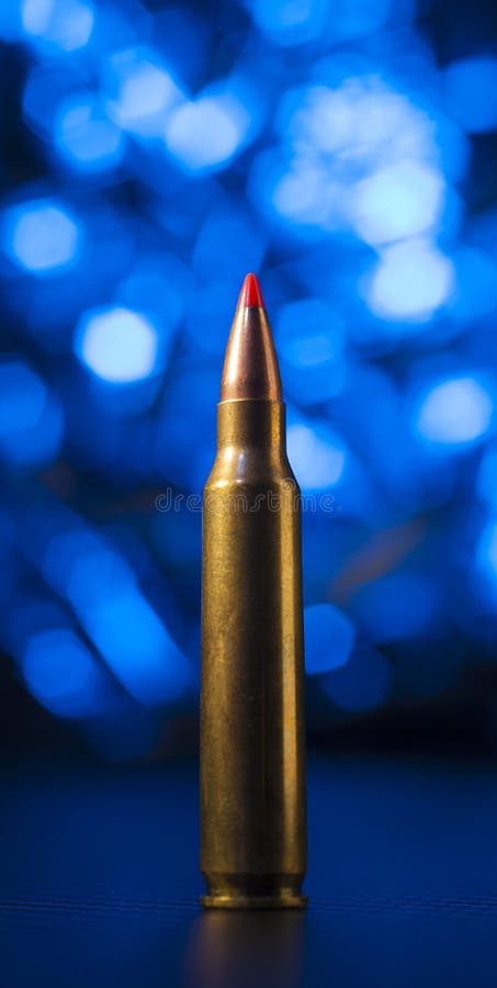 Bullet and blue stock photo. Image of brass, bronze - 103852084