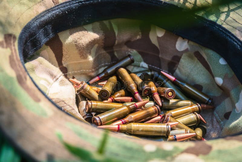 Cartridges for a Machine Gun in a Military Cap Stock Image - Image of ...