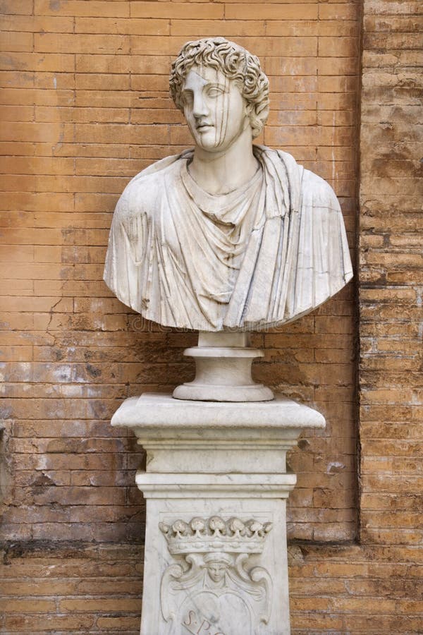 Carved Bust in Front of Brick Wall Stock Photo - Image of historic ...