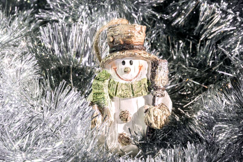 Carved Old Fashioned Snowman Amidst Silver Tinsel Stock Image - Image ...