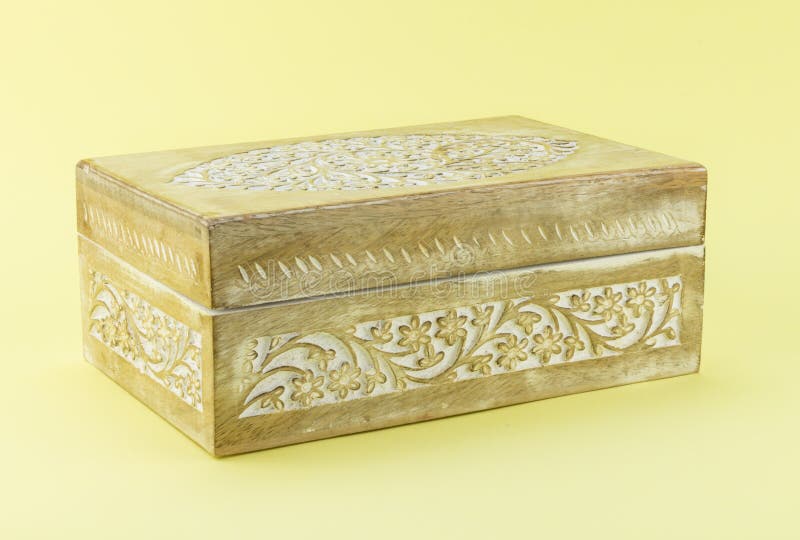 Carved Pale Wood Box Isolated on Yellow Background Stock Photo - Image ...
