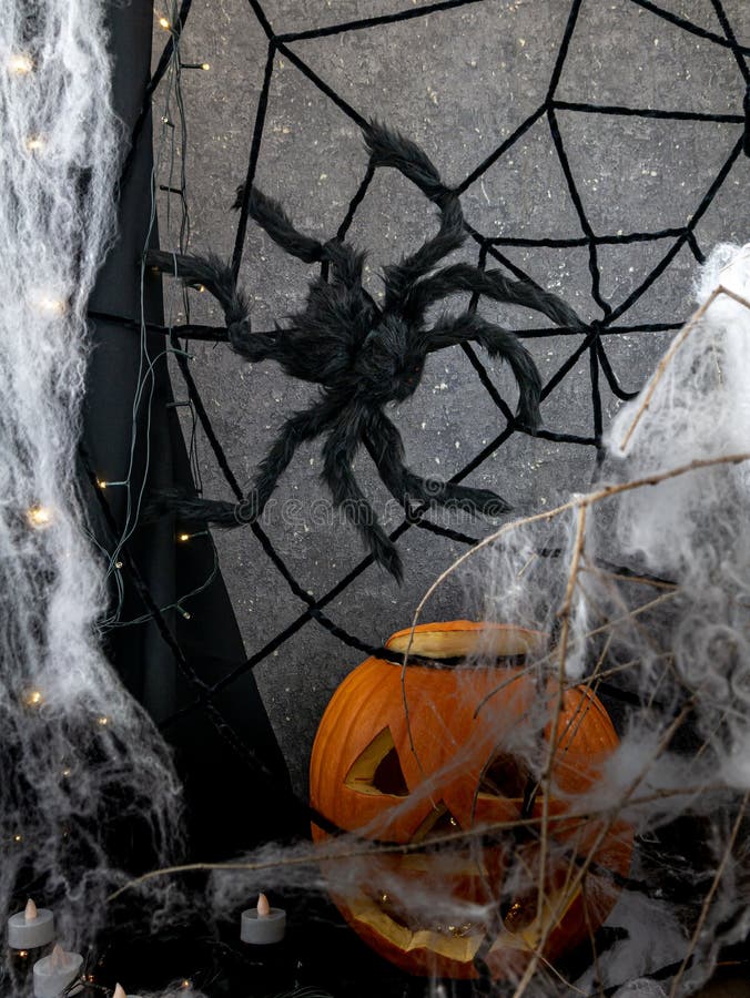 Carved Pumpkin for Halloween with White Spider Web with Black Spiders ...