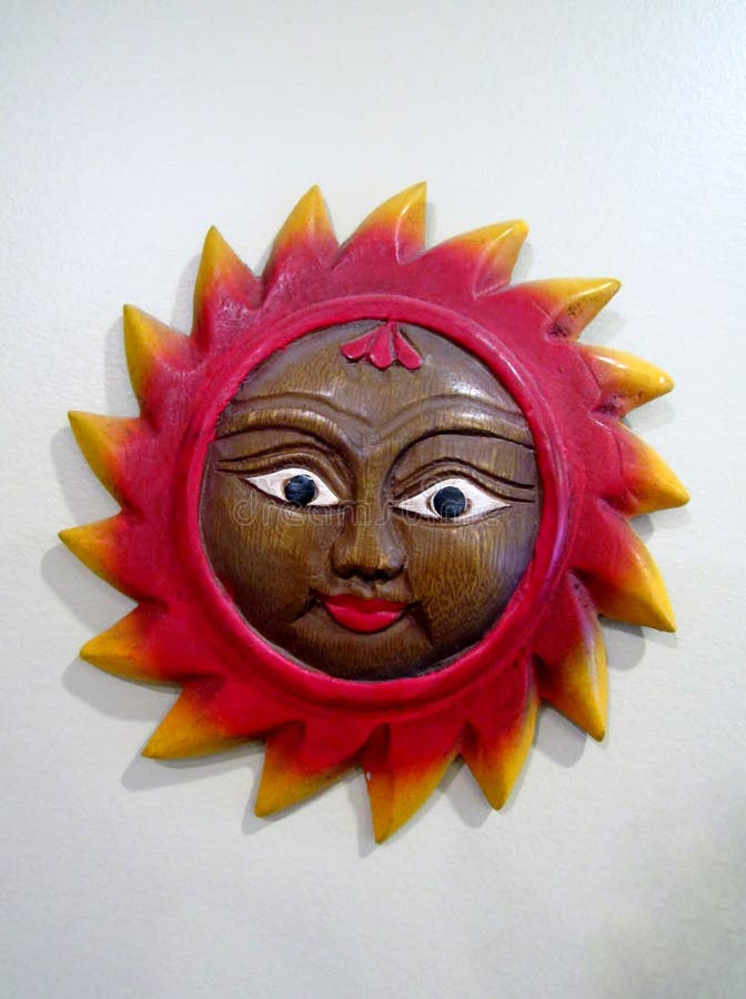Carved Sun Face Plaque on White Wall Stock Image - Image of handcraft, pattern: 187063147