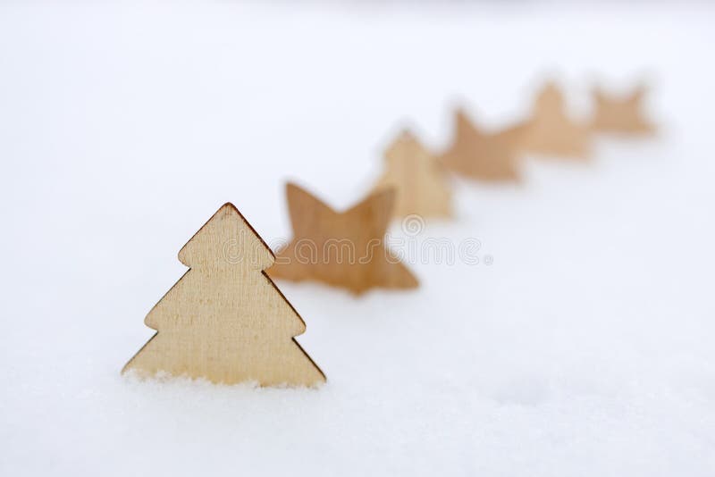 A Row of Carved Decorative Toys Inserted into the Snow Stock Photo ...