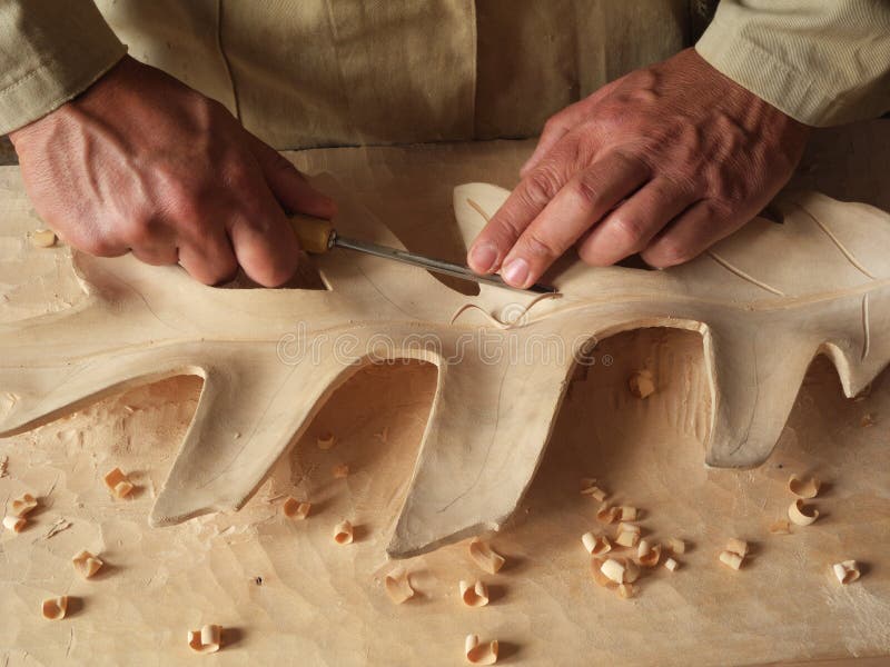 Carving a leaf in wood stock image. Image of skill, woodwork - 26789051