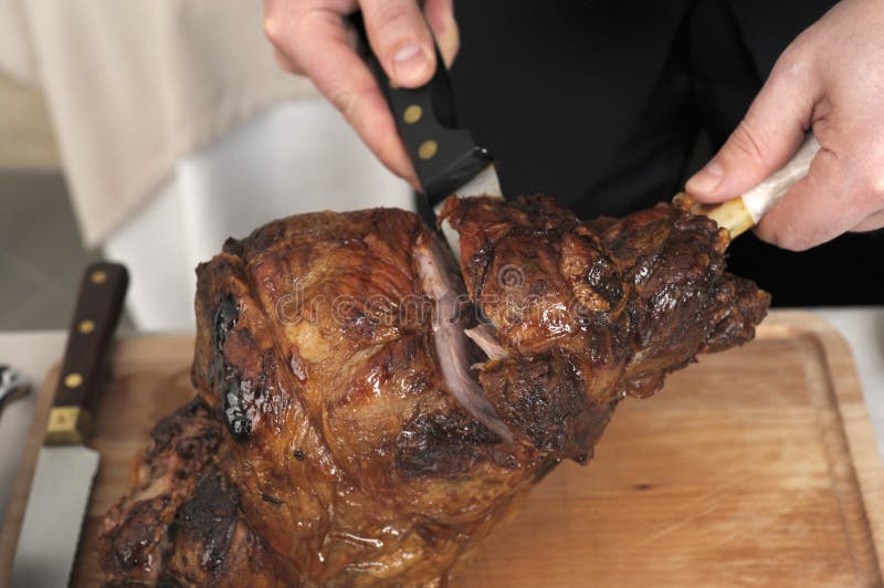 Carving a leg of lamb stock photo. Image of hand, gastronomy - 23709900