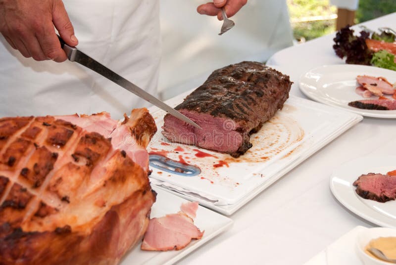 Carving sirloin of beef stock image. Image of plates - 12829845