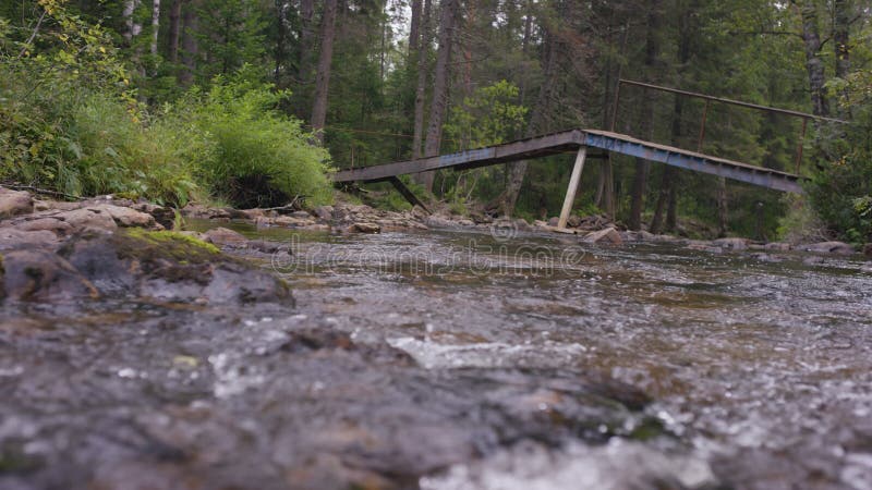 Cascade Falls, Fast Flowing Waterfall. River Flows Under a Wooden ...