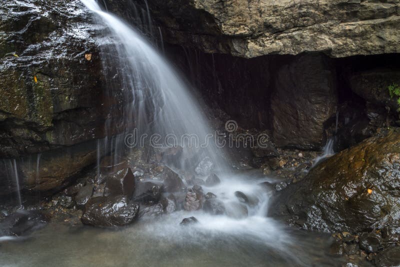 Cascade falls with rocks stock photo. Image of cascade - 57971612
